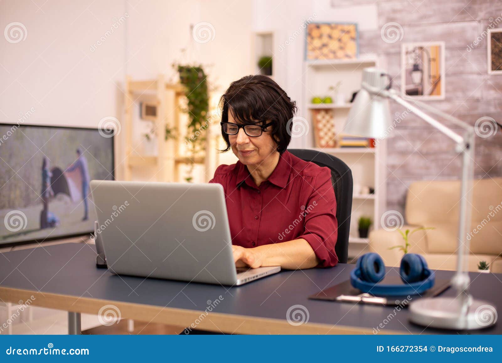 Old Woman Using a Modern Computer in Her Living Room Stock Photo ...