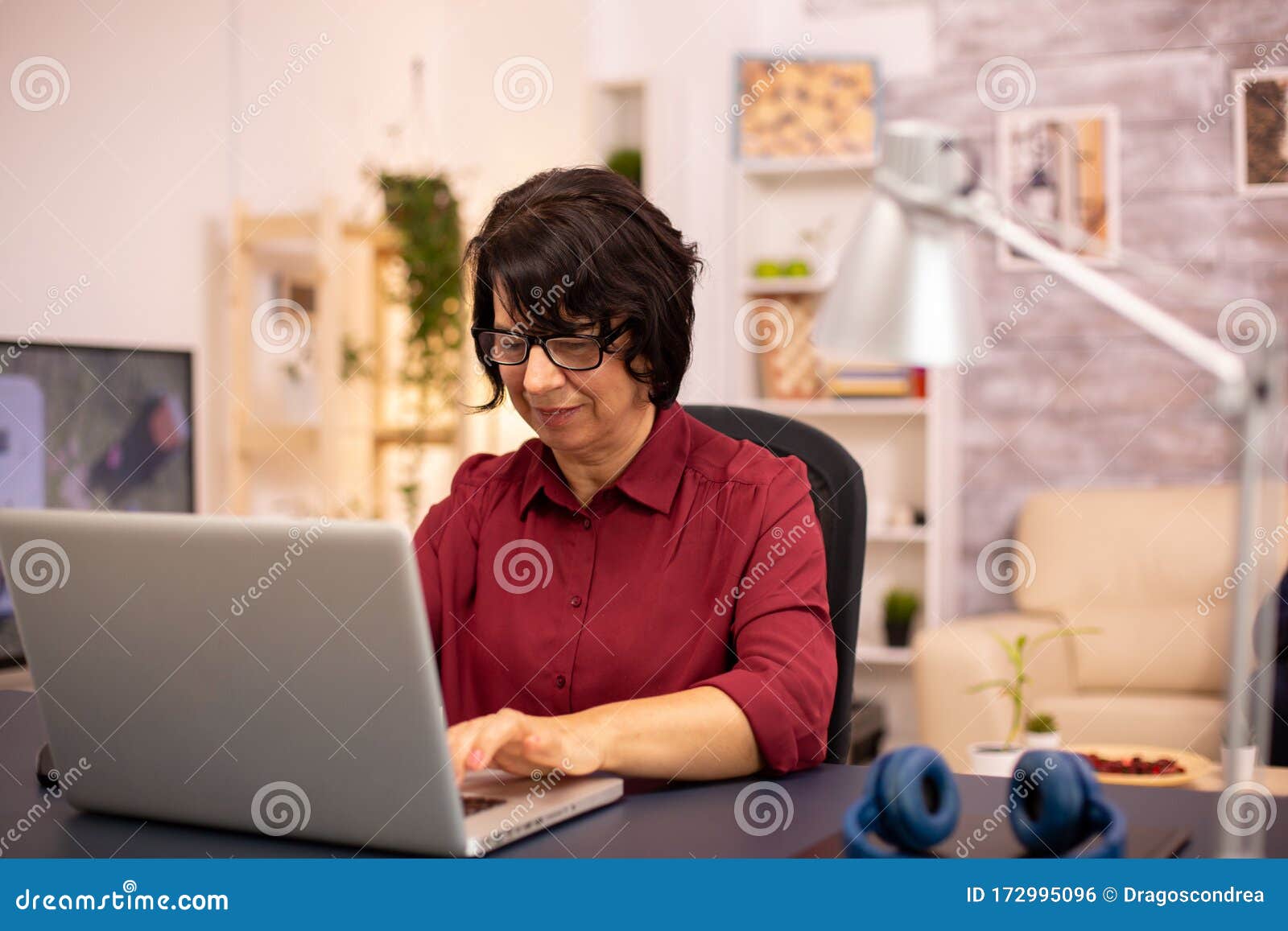 Old Woman Using a Modern Computer in Her Living Room Stock Photo ...