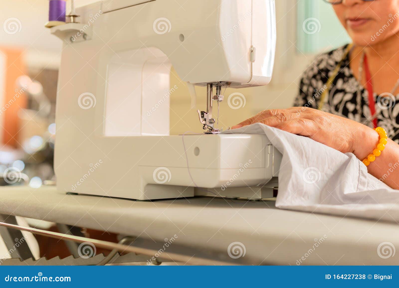 Old Women Hands Stitching Fabric on Sewing Machine at Home. Stock Photo ...