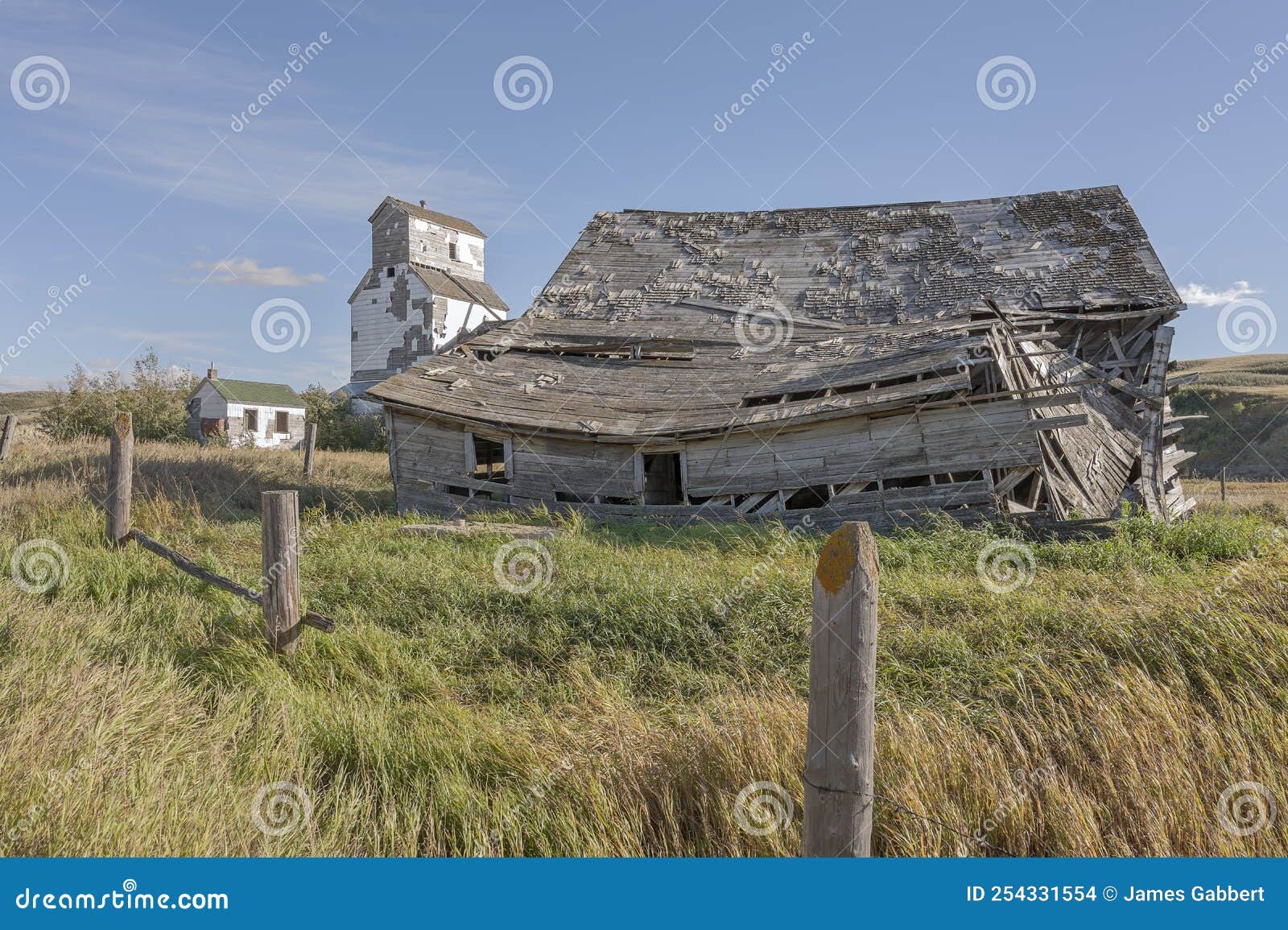 Old Barn and Grain Elevator in a Ghost Town Stock Photo - Image of ...