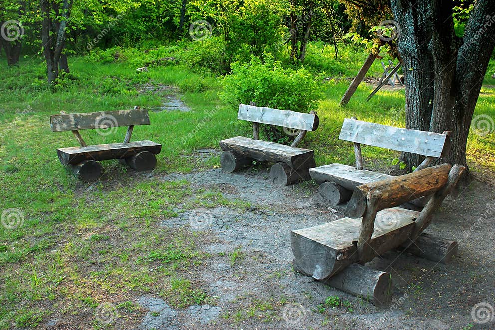 Old Wooden Benches Hand Made from Tree Trunks in the Forest Stock Image ...