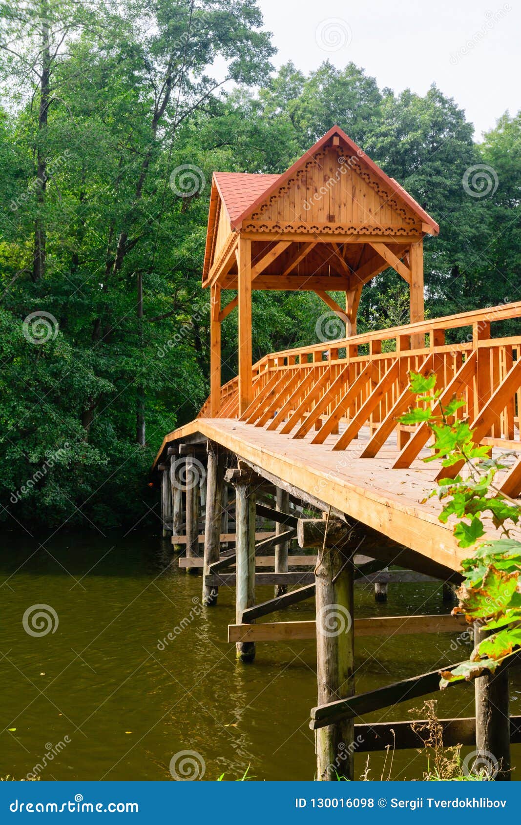 Old Wooden Bridge Over the River with Arbor. Forest River. Stock Photo ...