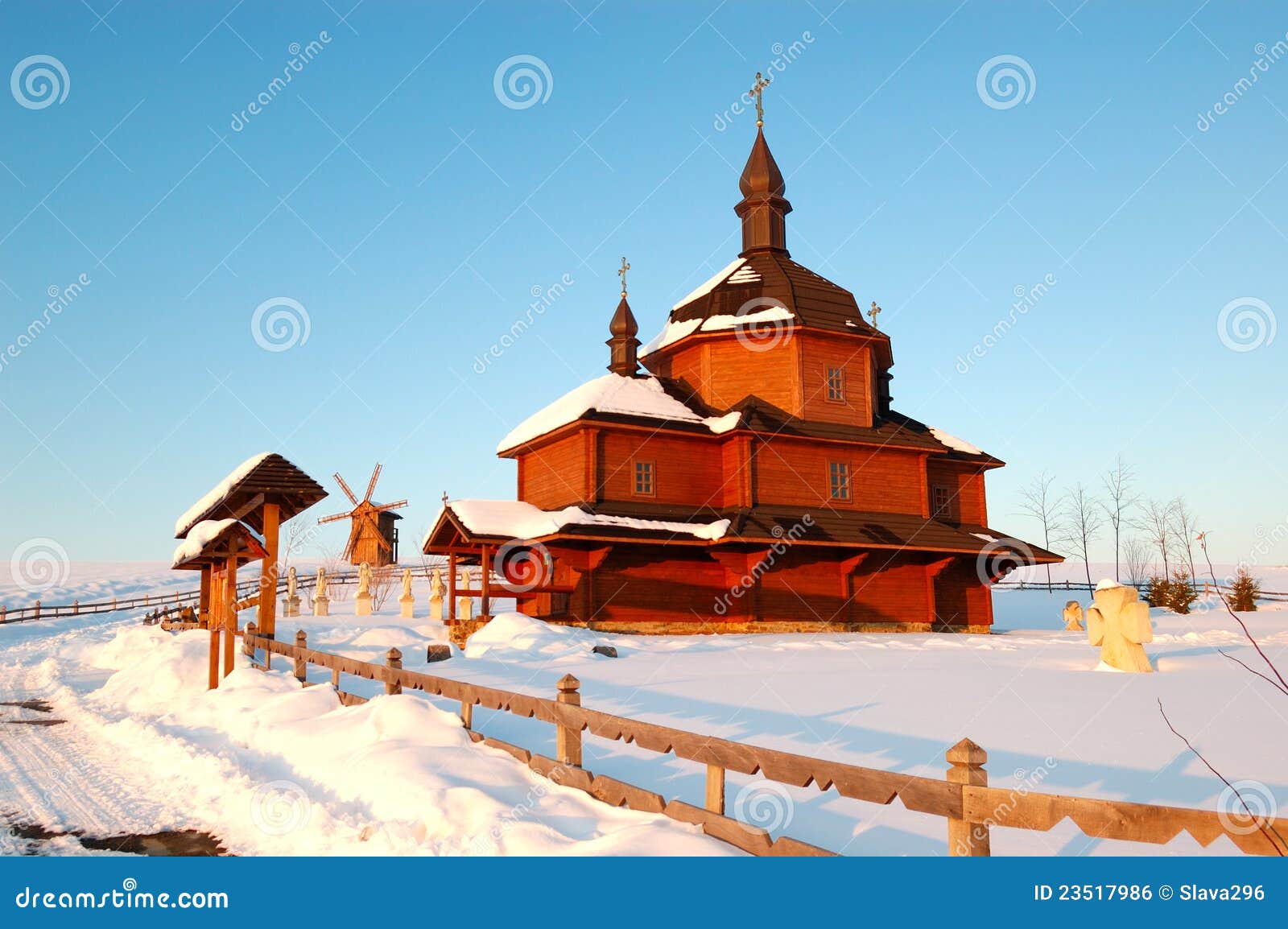 The Old Wooden Church and Windmill at Background Stock Photo - Image of ...