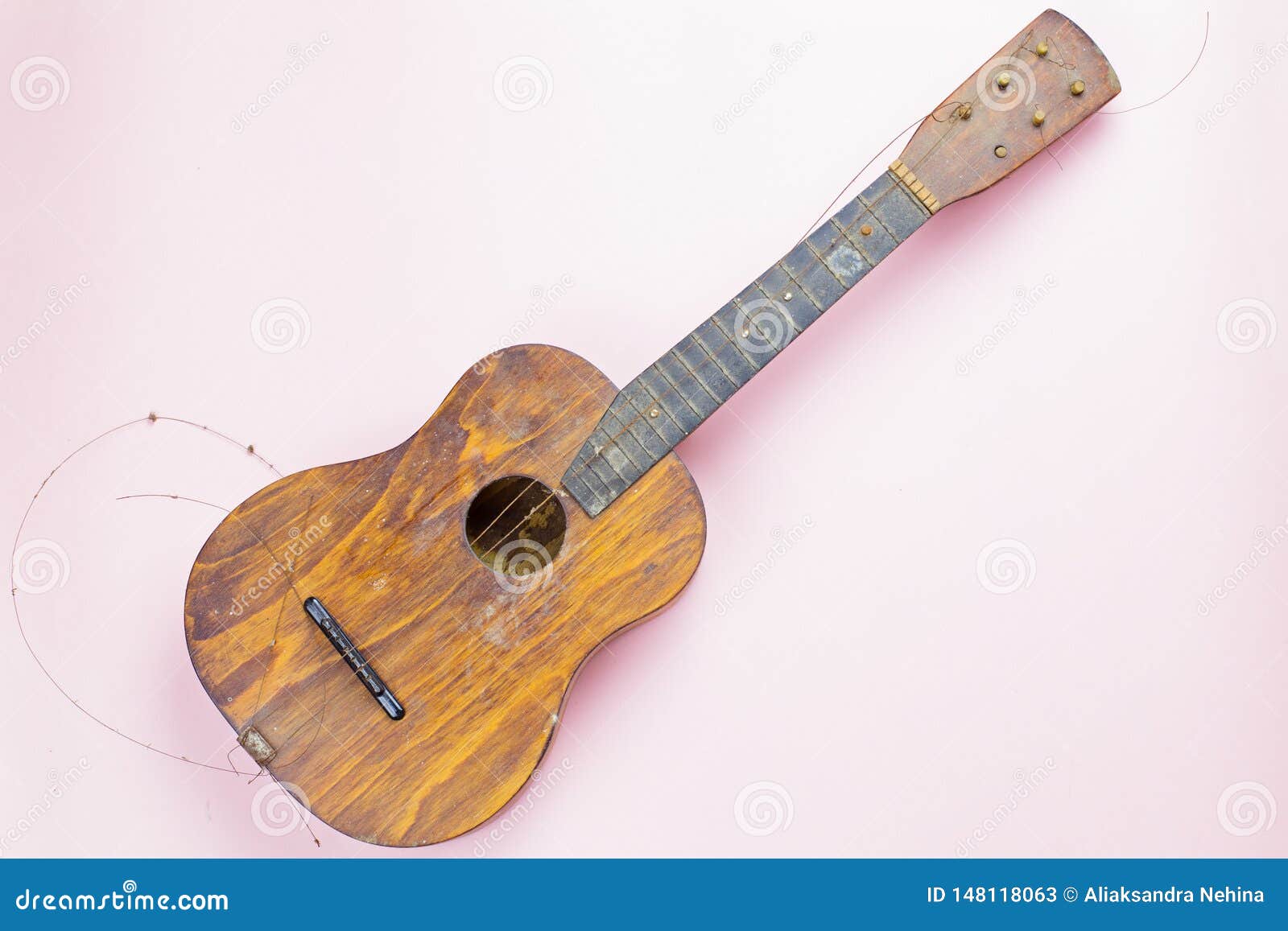 Old Guitar with Broken Strings on a Pink Background Stock Image - Image ...