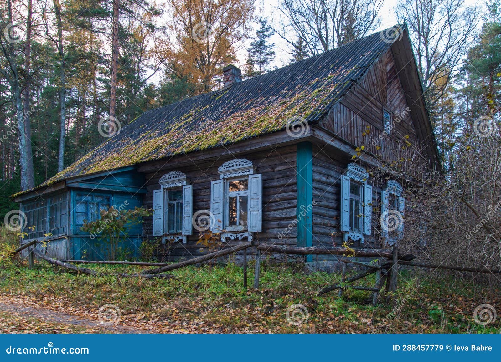 An Old Wooden House with White Window Shutters in the Fall Stock Image ...