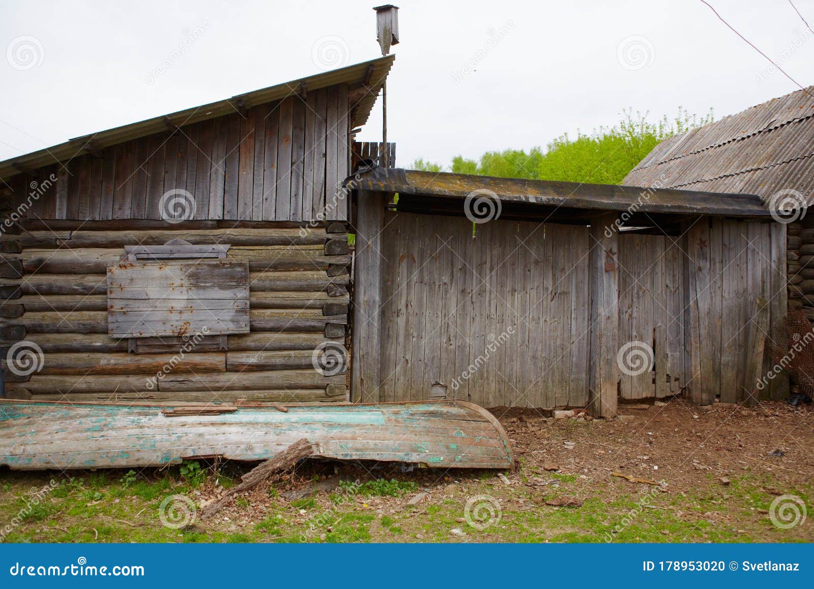 An Old Wooden Hut and a Rotten Wooden Boat. Stock Photo - Image of ...