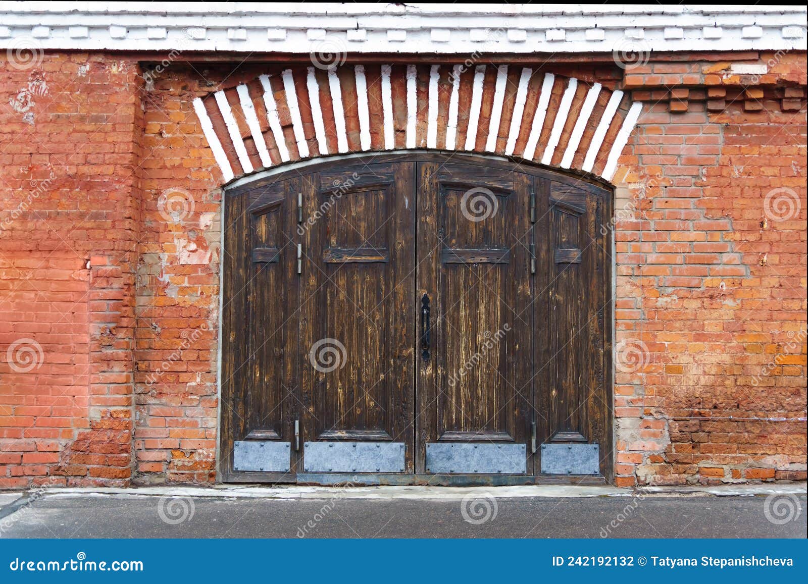 Old Wooden Large Gate in a Brick Wall with an Arched Top Stock Photo ...