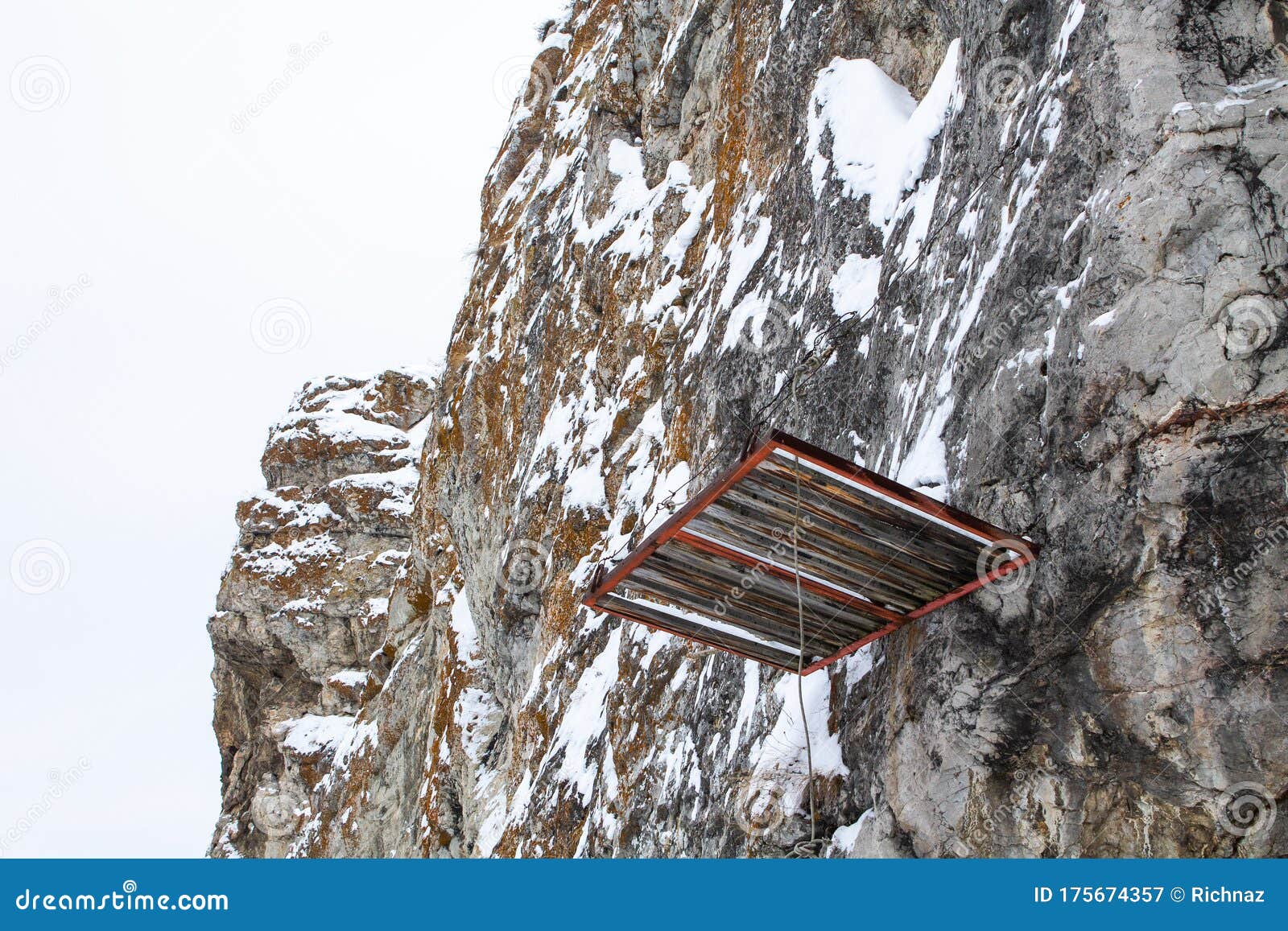 An Old Wooden Lifting Platform on a Large Stone Cliff Stock Image ...
