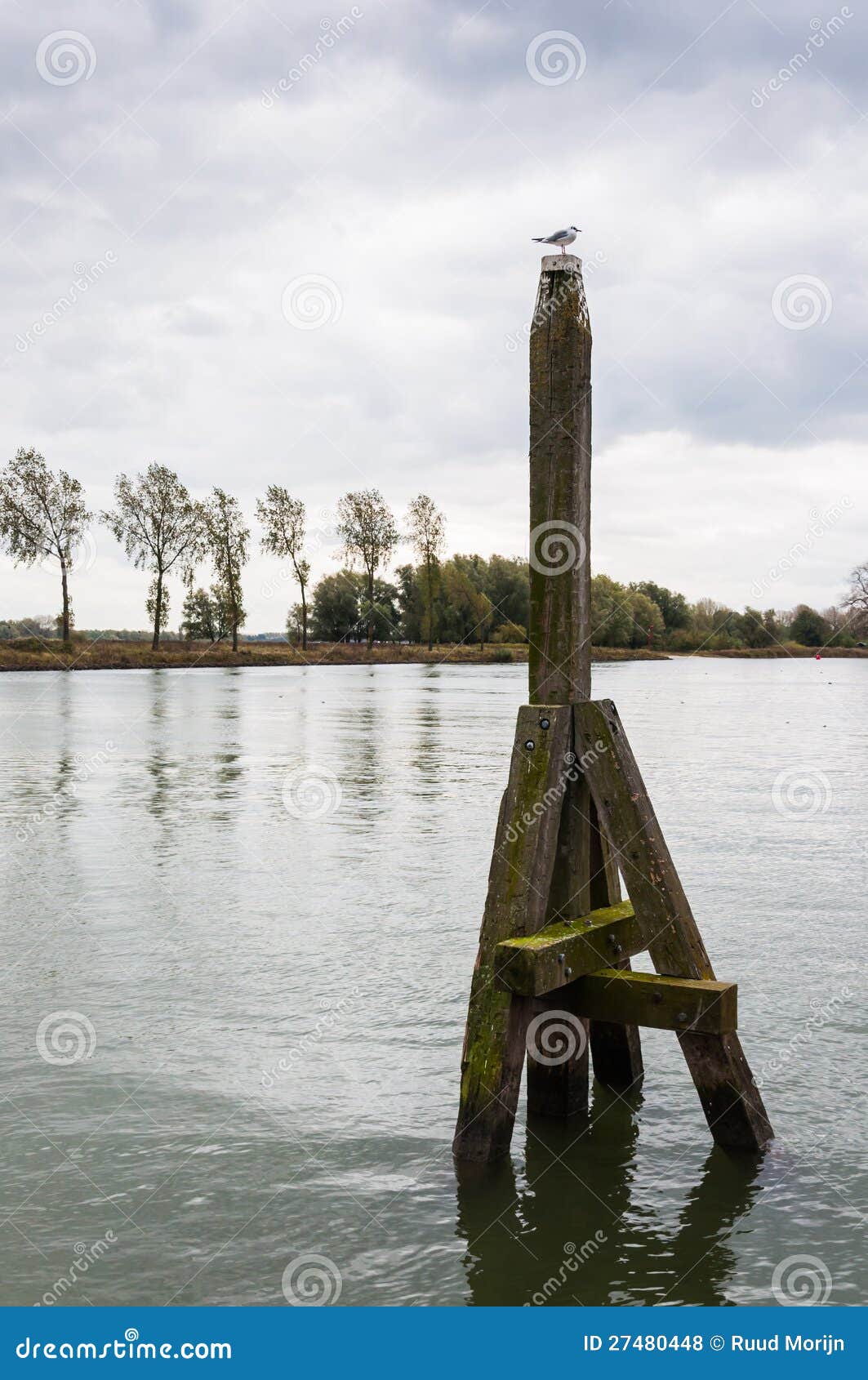 Old Wooden Mooring Post on a Cloudy Day Stock Photo - Image of autumnal ...