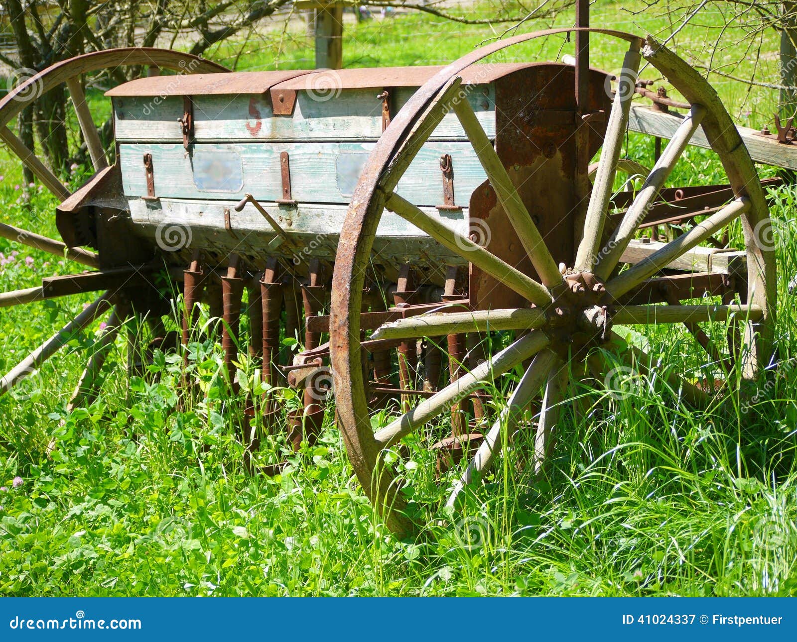 Old Wooden and Rusty Iron Barrow Suspended in Grass Stock Image - Image ...