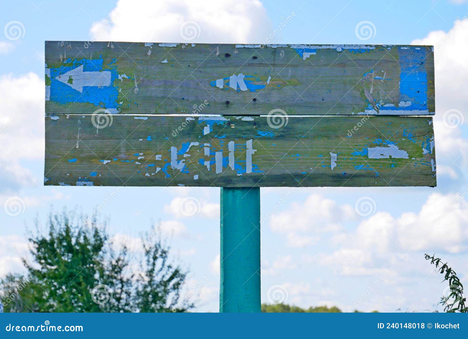 An Old Wooden Sign with Remnants of Paint and an Arrow. Stock Photo ...
