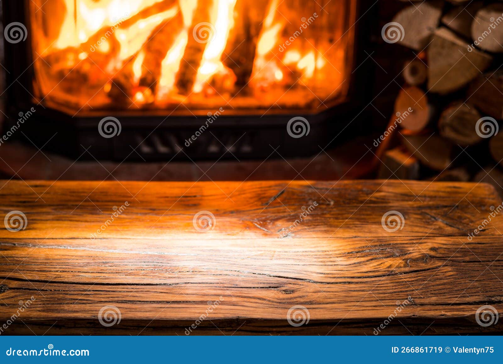 Old Wooden Table and Fireplace with Warm Fire at the Background Stock ...