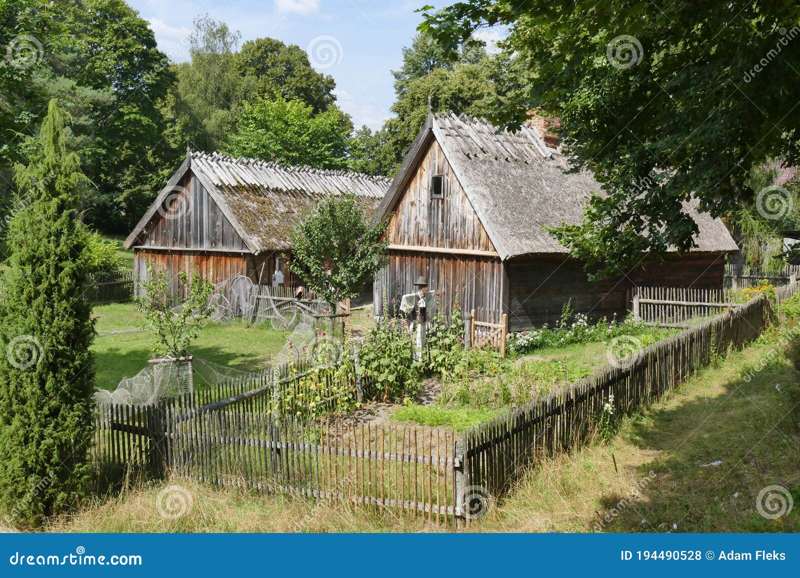 Old Wooden Traditional Polish Wooden Village Houses With Flower Garden