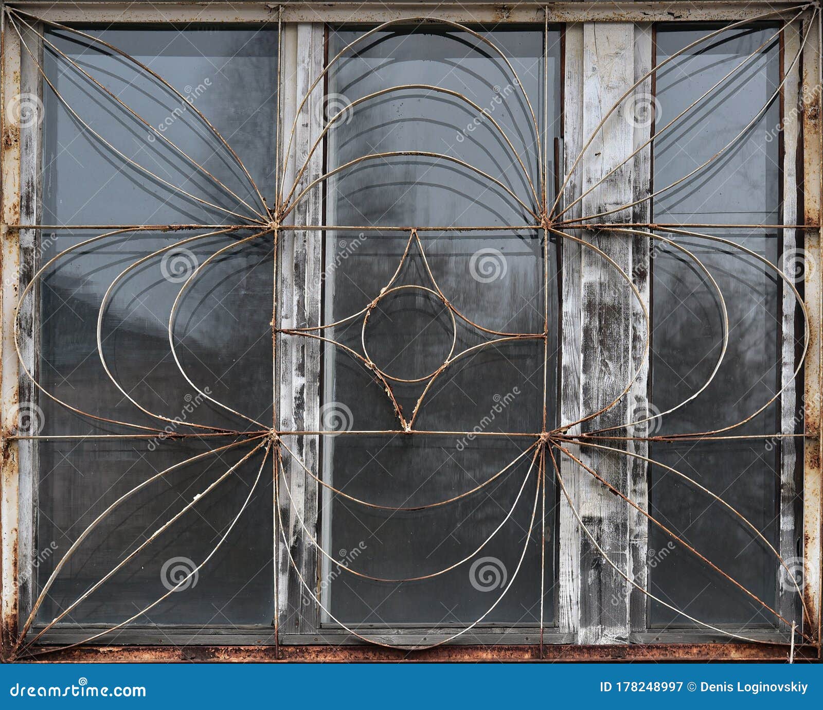 An Old Wooden Window with a Metal Grille. the Texture of the Window ...