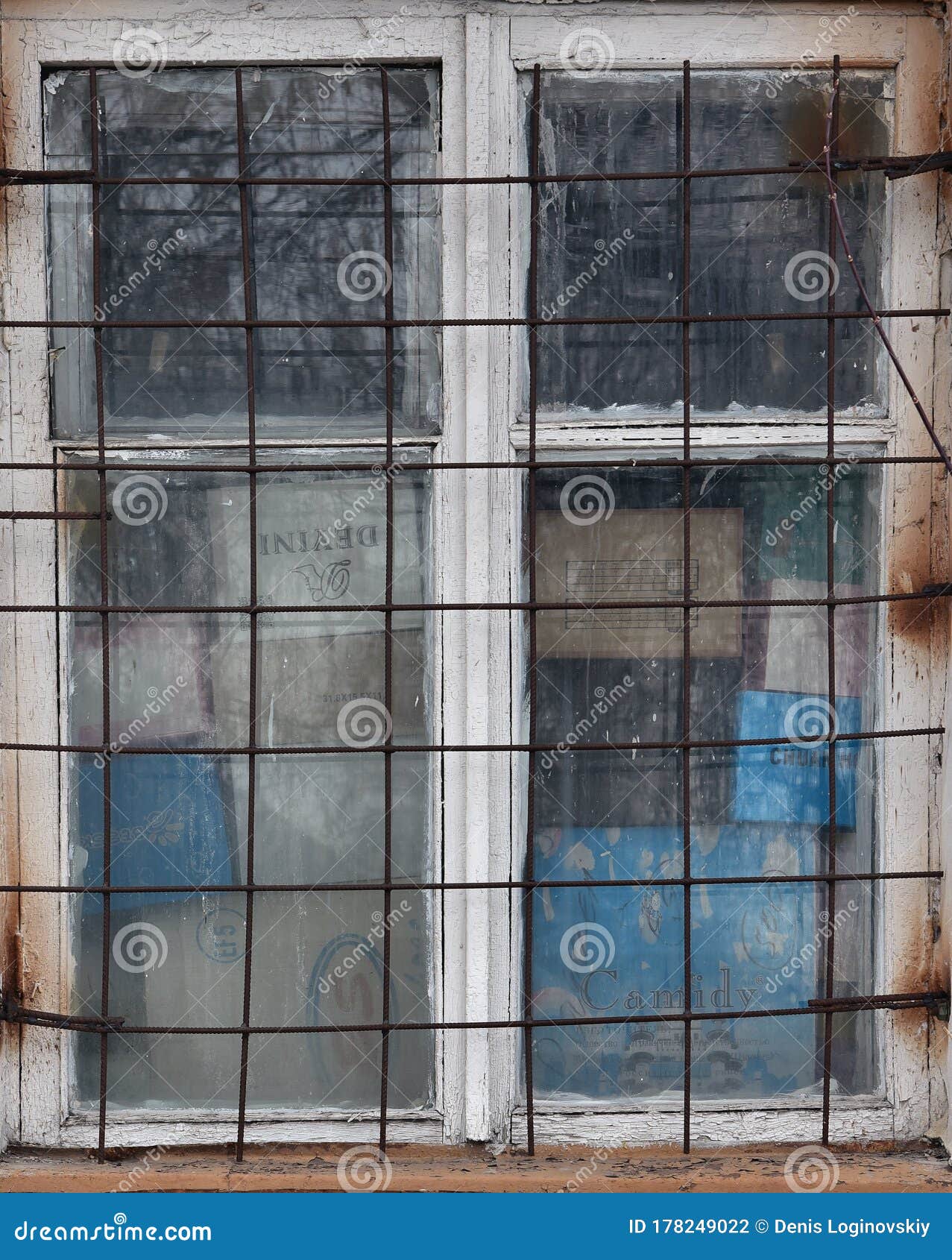 An Old Wooden Window With A Metal Grille. The Texture Of The Window ...