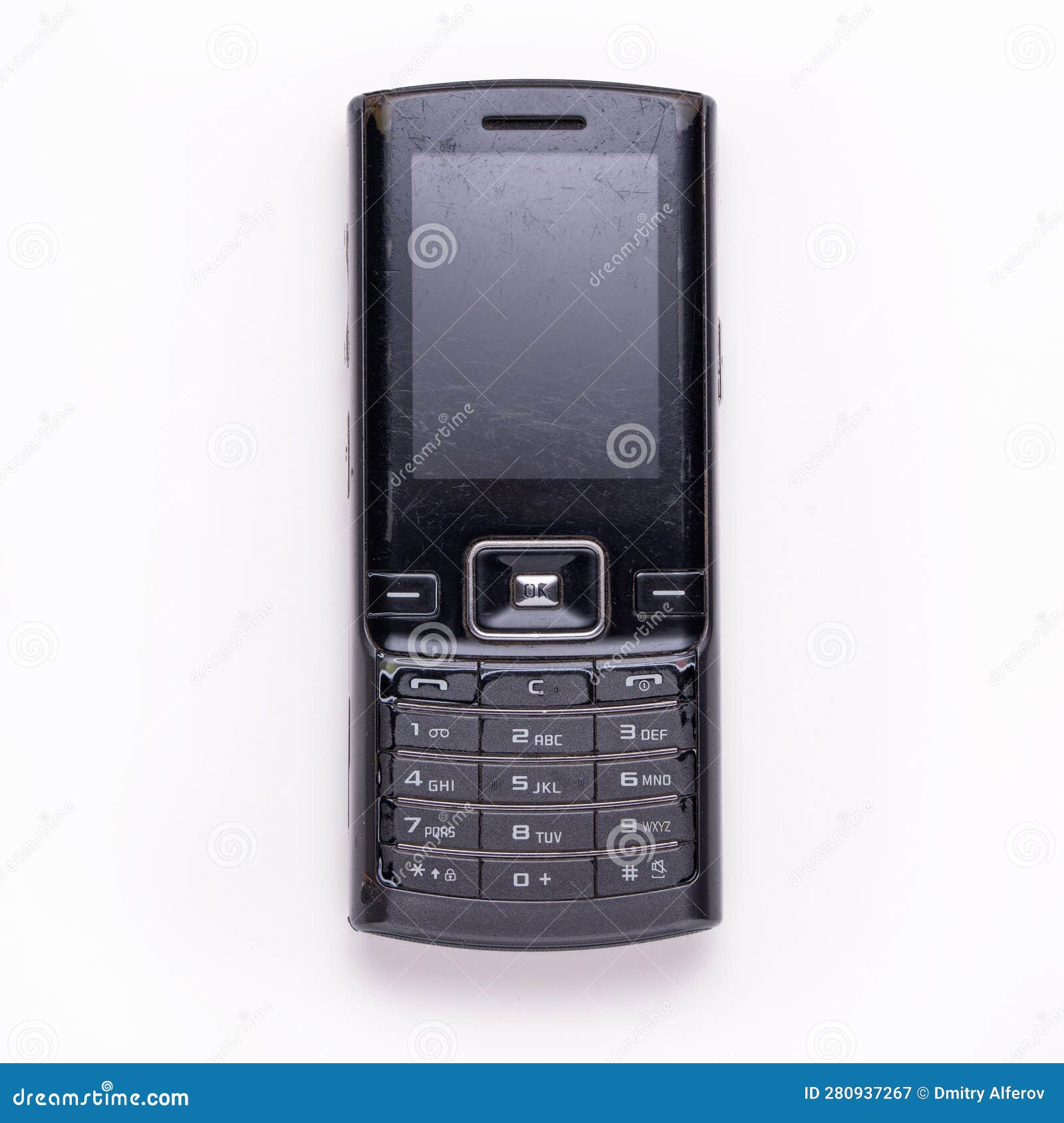 An Old Worn-out Push-button Mobile Phone on a White Background Stock ...