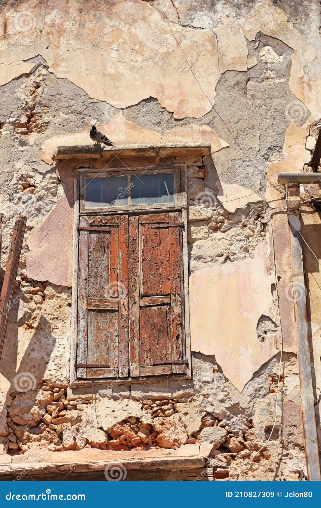 Old Worn Shutters on an Old Dilapidated Building Stock Image - Image of ...