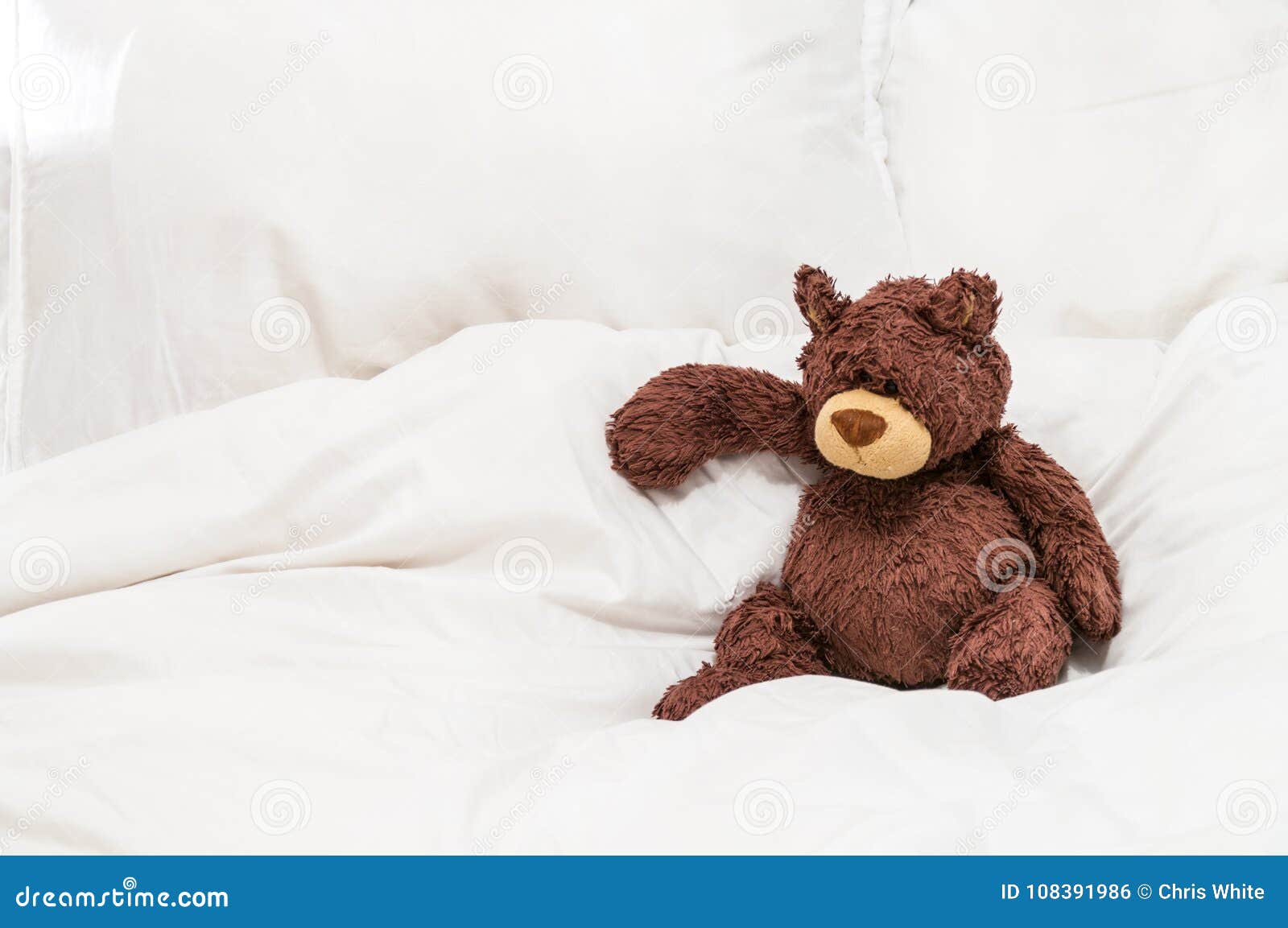 An Old, Worn Teddy Bear Sat on a Bed Stock Photo - Image of animal ...