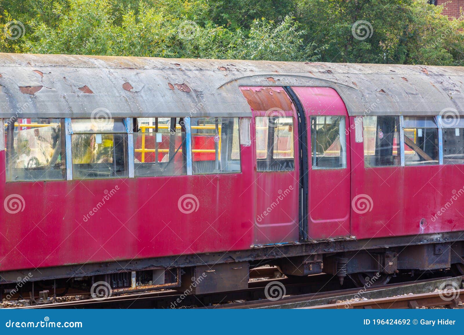 An Old and Worn Train Carriage on Train Tracks Stock Photo - Image of ...