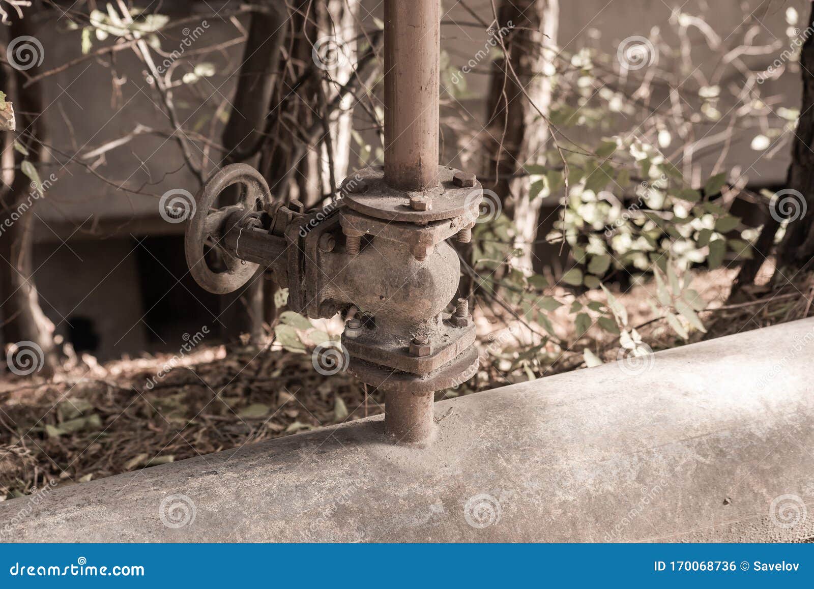 Old worn valve on pipes stock photo. Image of heavy - 170068736