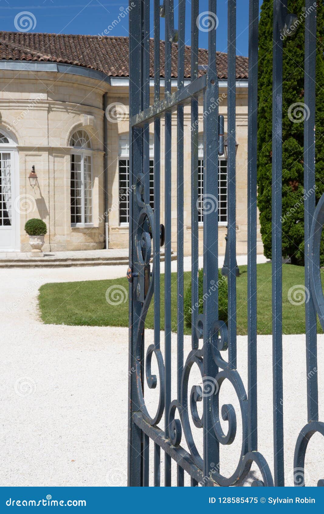 Old Wrought Iron Gate Open on the Courtyard of the Beautiful House ...