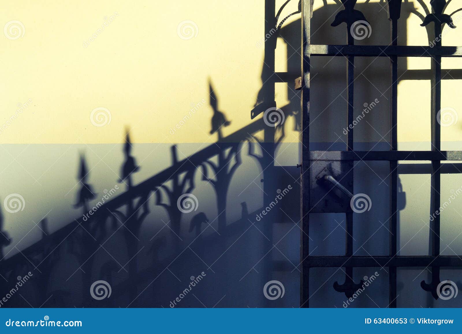 The Old Wrought-iron Gates with a Shadow on the Wall Stock Image ...