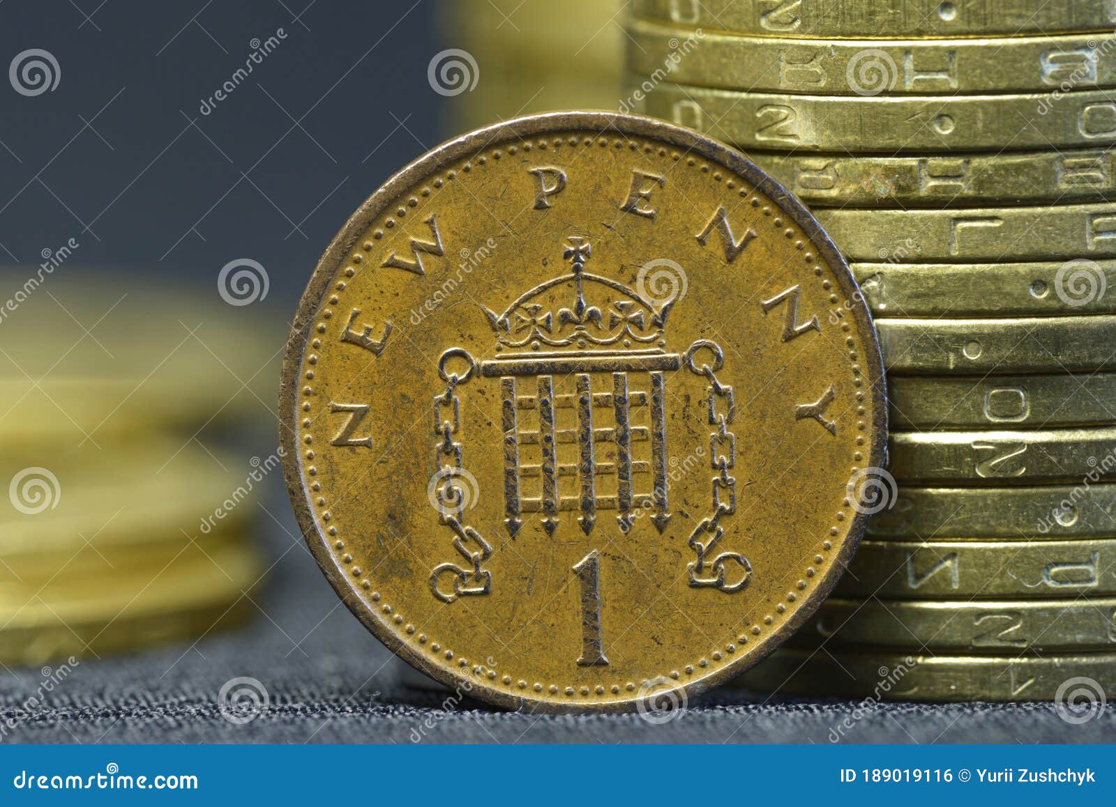 An Old, 1980 Year, One Penny Coin Put on Edge in Front of Piles of ...