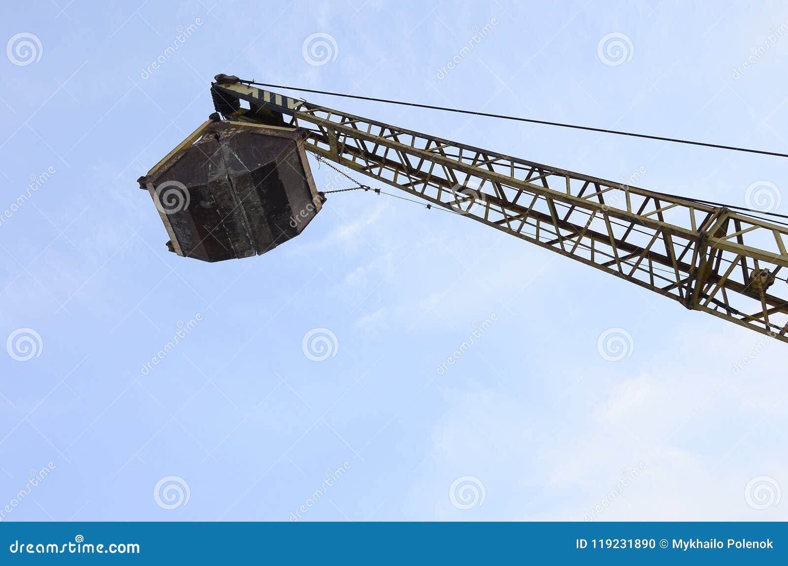 Old Yellow Mechanical Clamshell Grab on Blue Sky Background Stock Photo ...