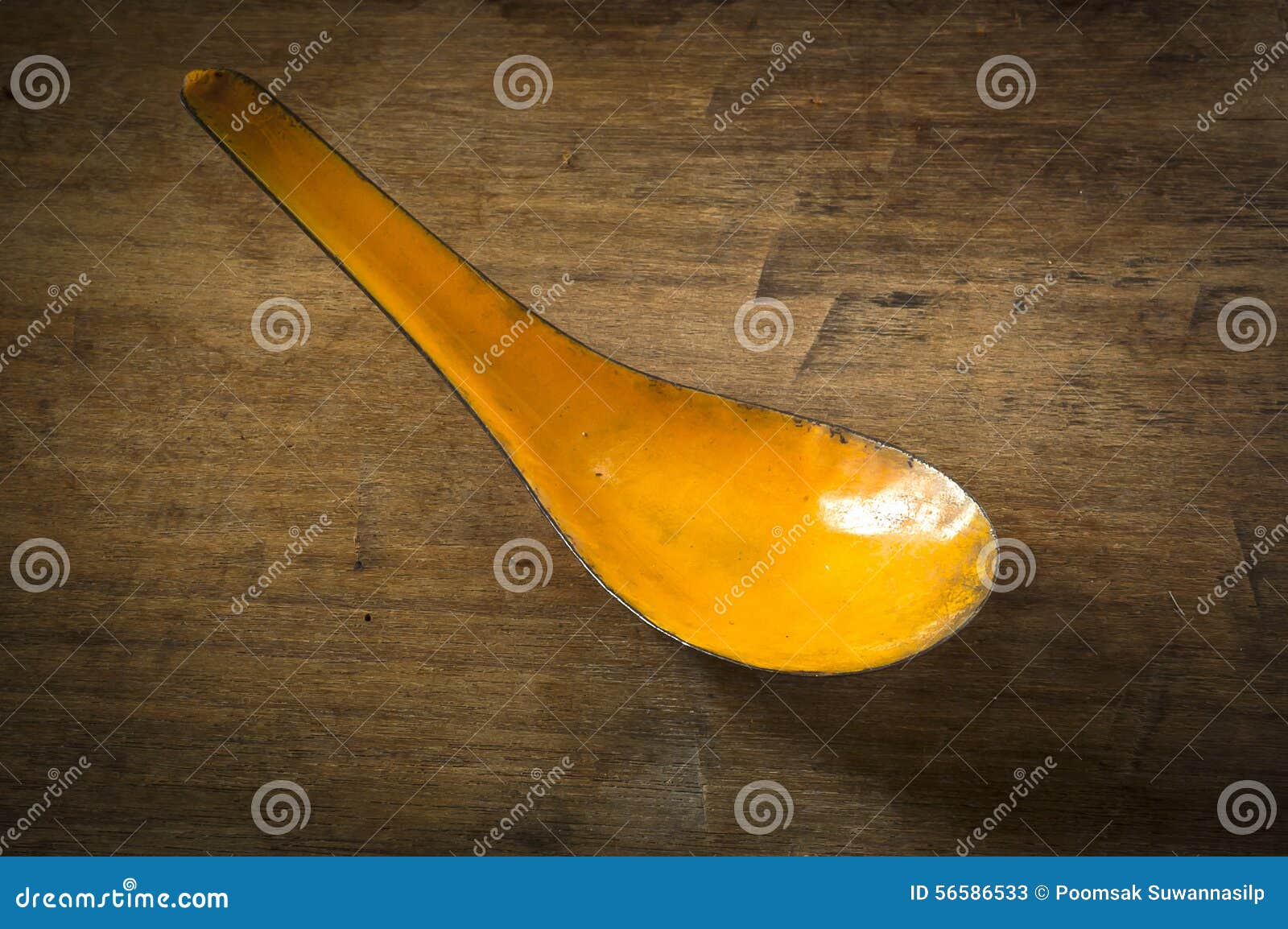 Old Yellow Spoon Placed on a Wooden Table Low Key Light. Stock Image ...