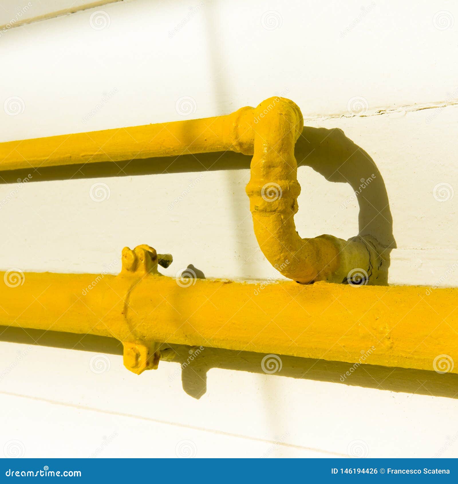 Old Yellow Water Pipes in Front of Wall Stock Photo - Image of industry ...