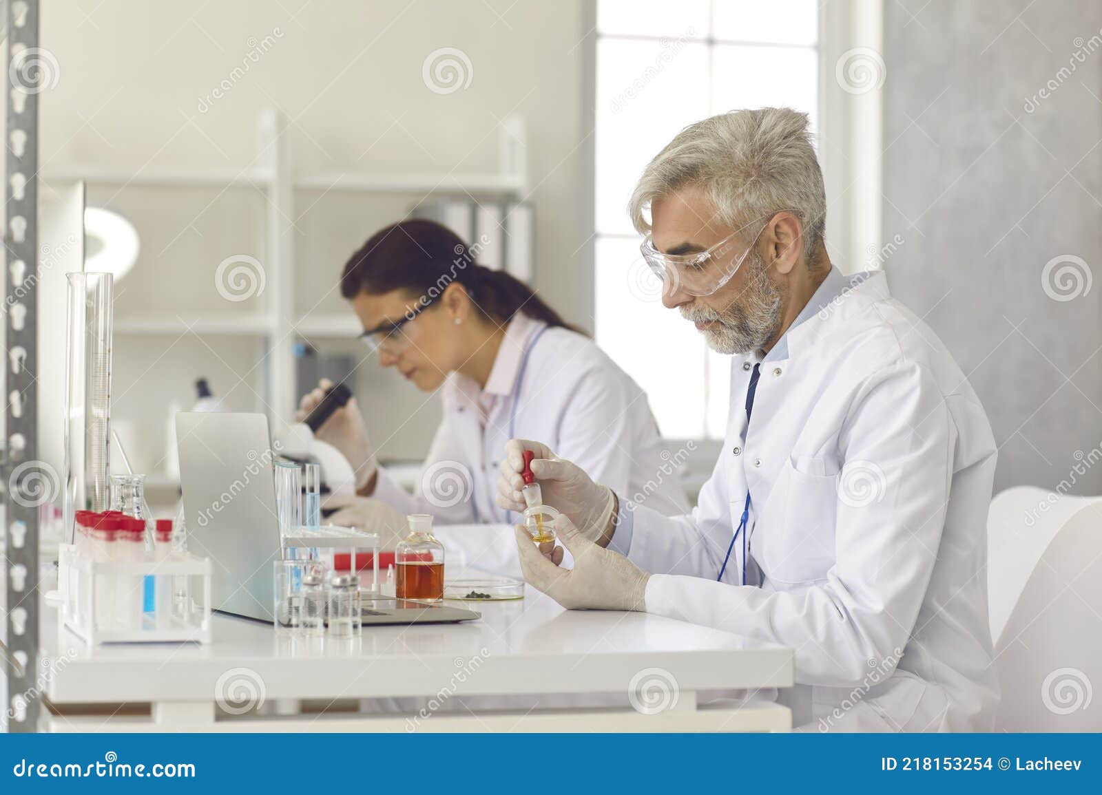Old and Young Scientist Working at Science Laboratory Conducting ...