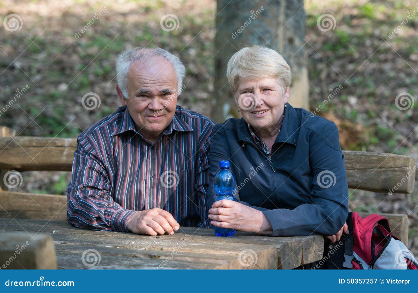 Older Couple Sitting on a Bench Stock Image - Image of space, male ...