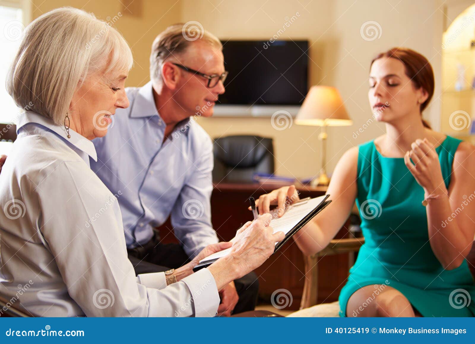 Older Couple Talking To Financial Advisor in Office Stock Image - Image ...
