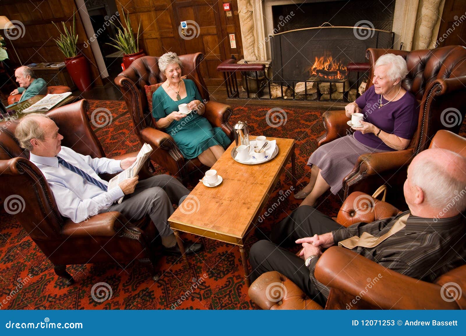 Older Group of Friends by Fireplace Stock Image - Image of drinking ...