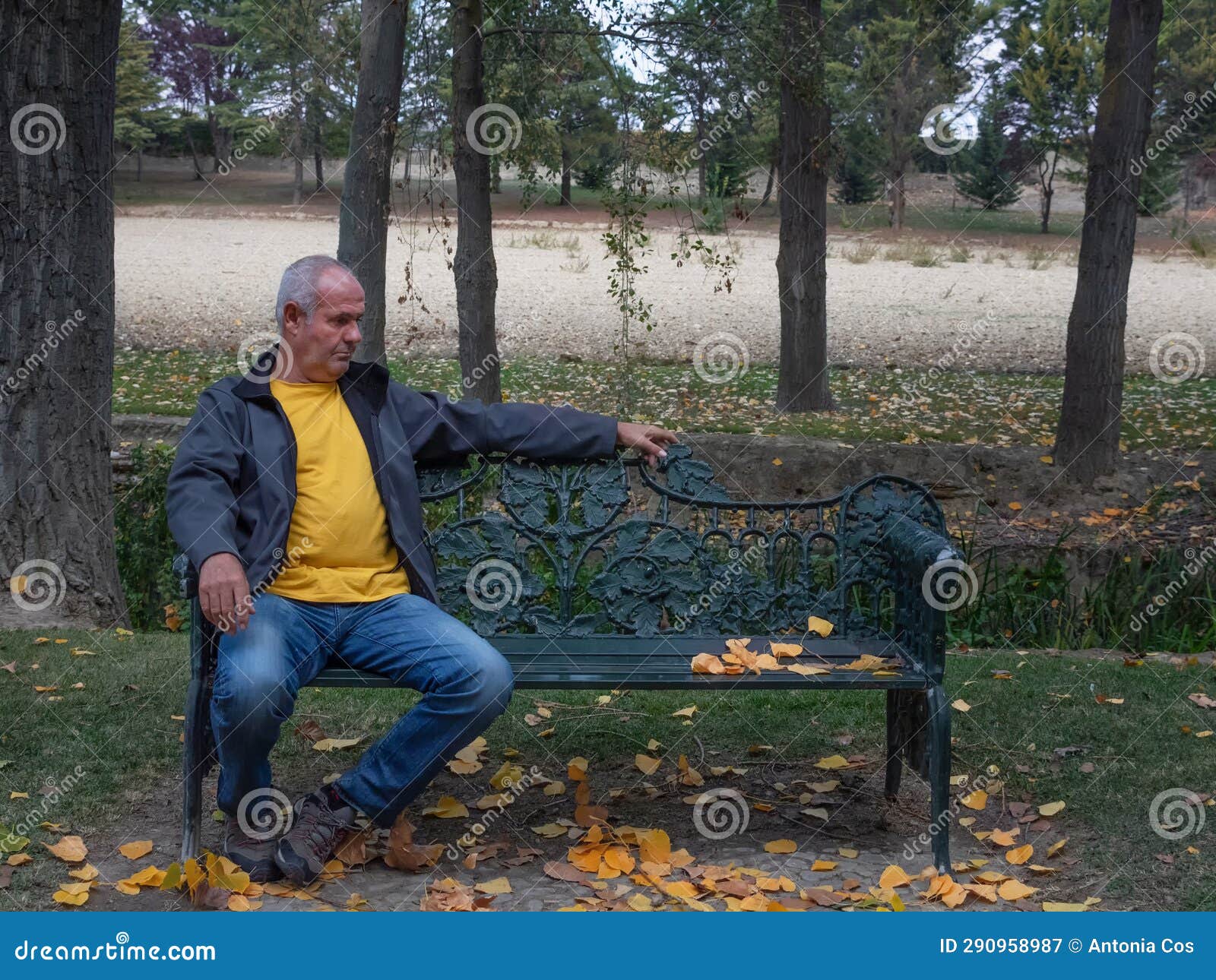 Older Man Alone Sitting on a Park Bench. Loneliness Concept Stock Image ...