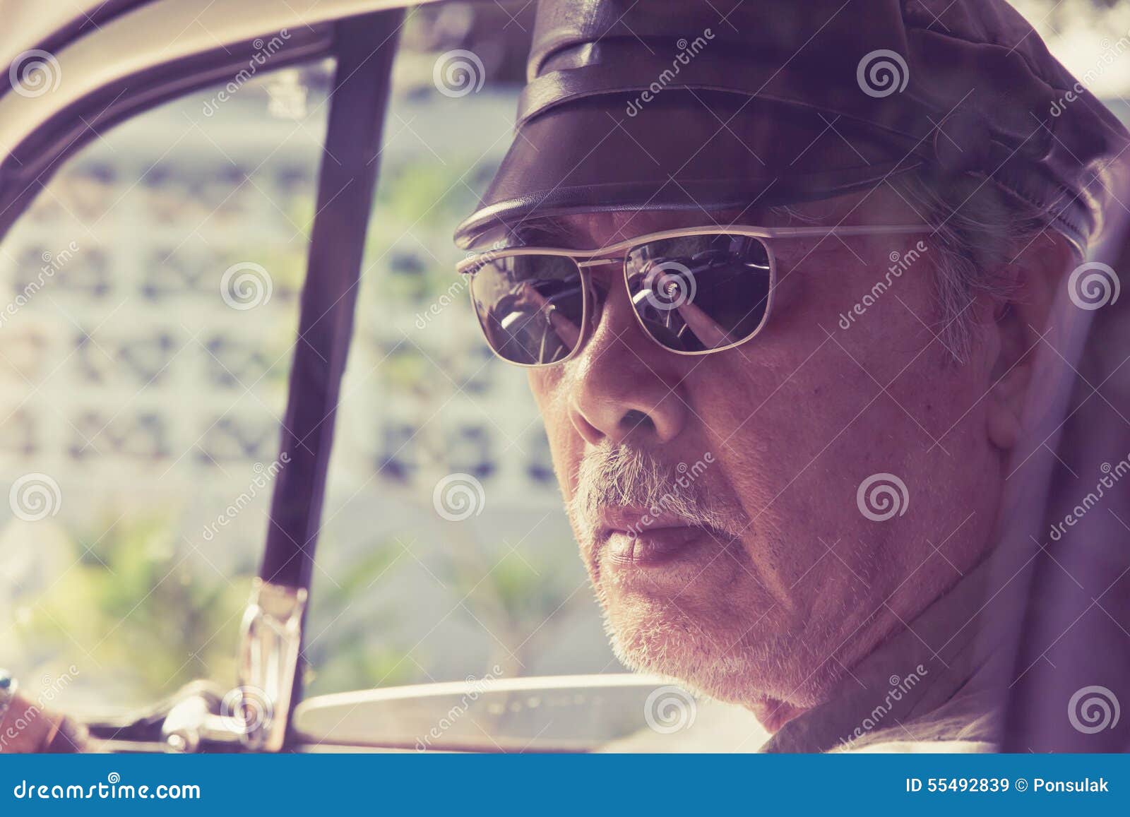 Older man driving a car stock image. Image of serious - 55492839