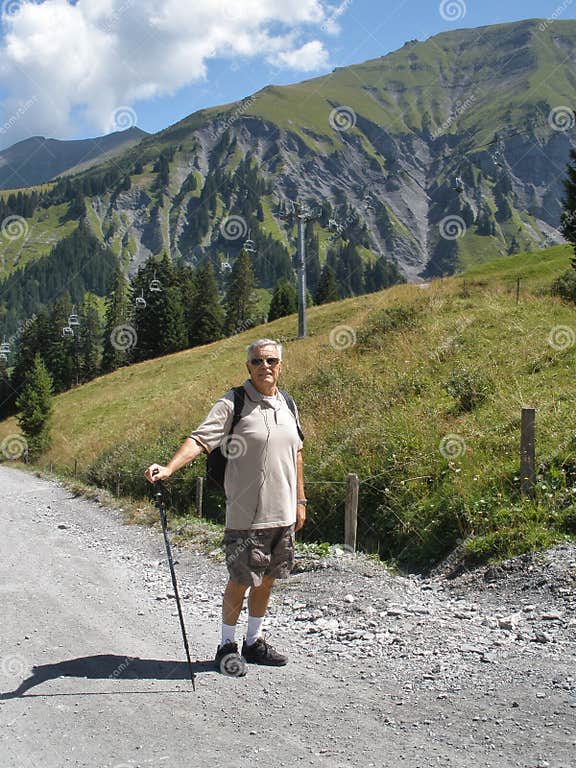 A older man Hiking stock image. Image of action, green - 19099291