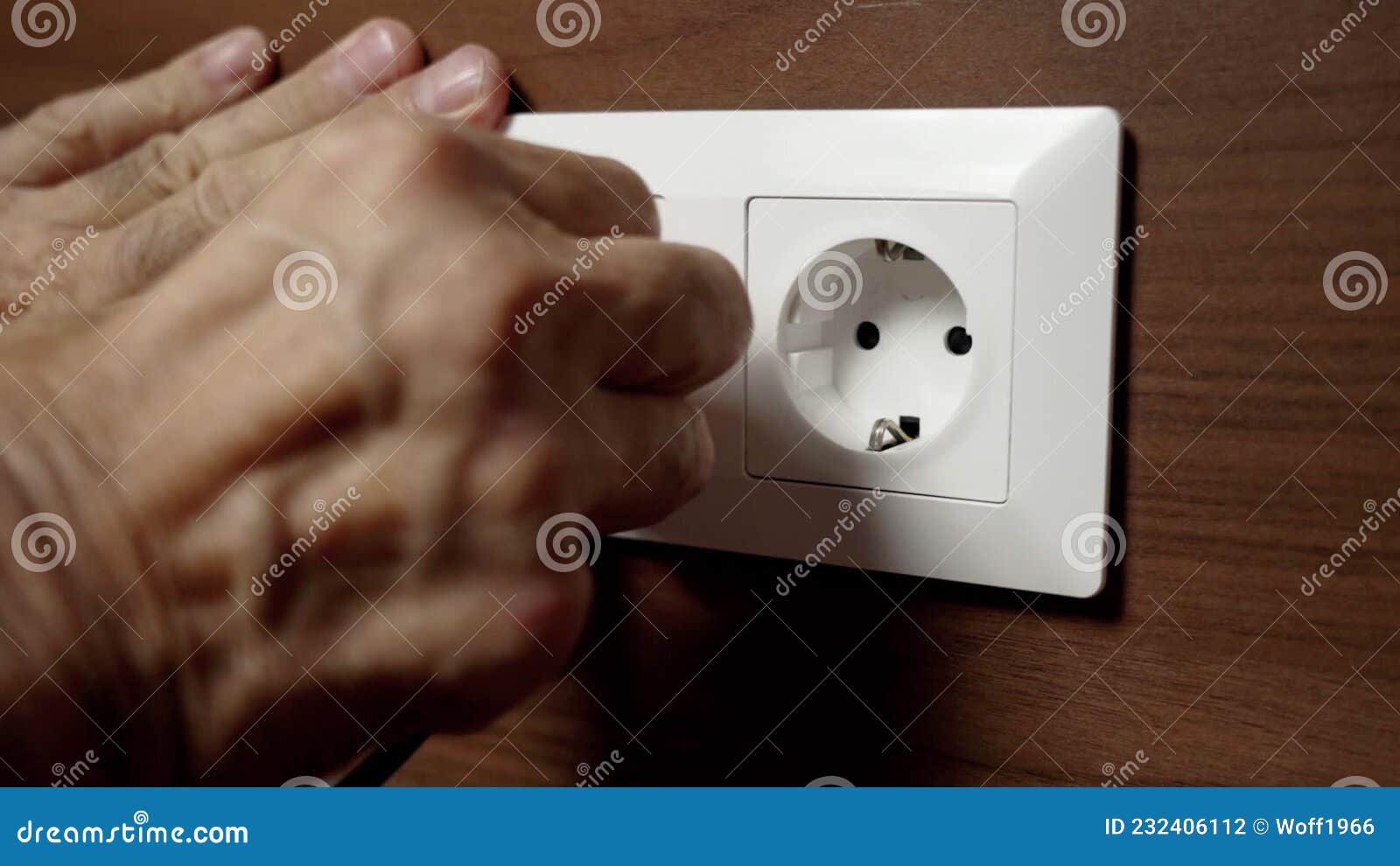 Senior Man S Hand Pull the Plug Out of the Plug on the Wall Stock ...