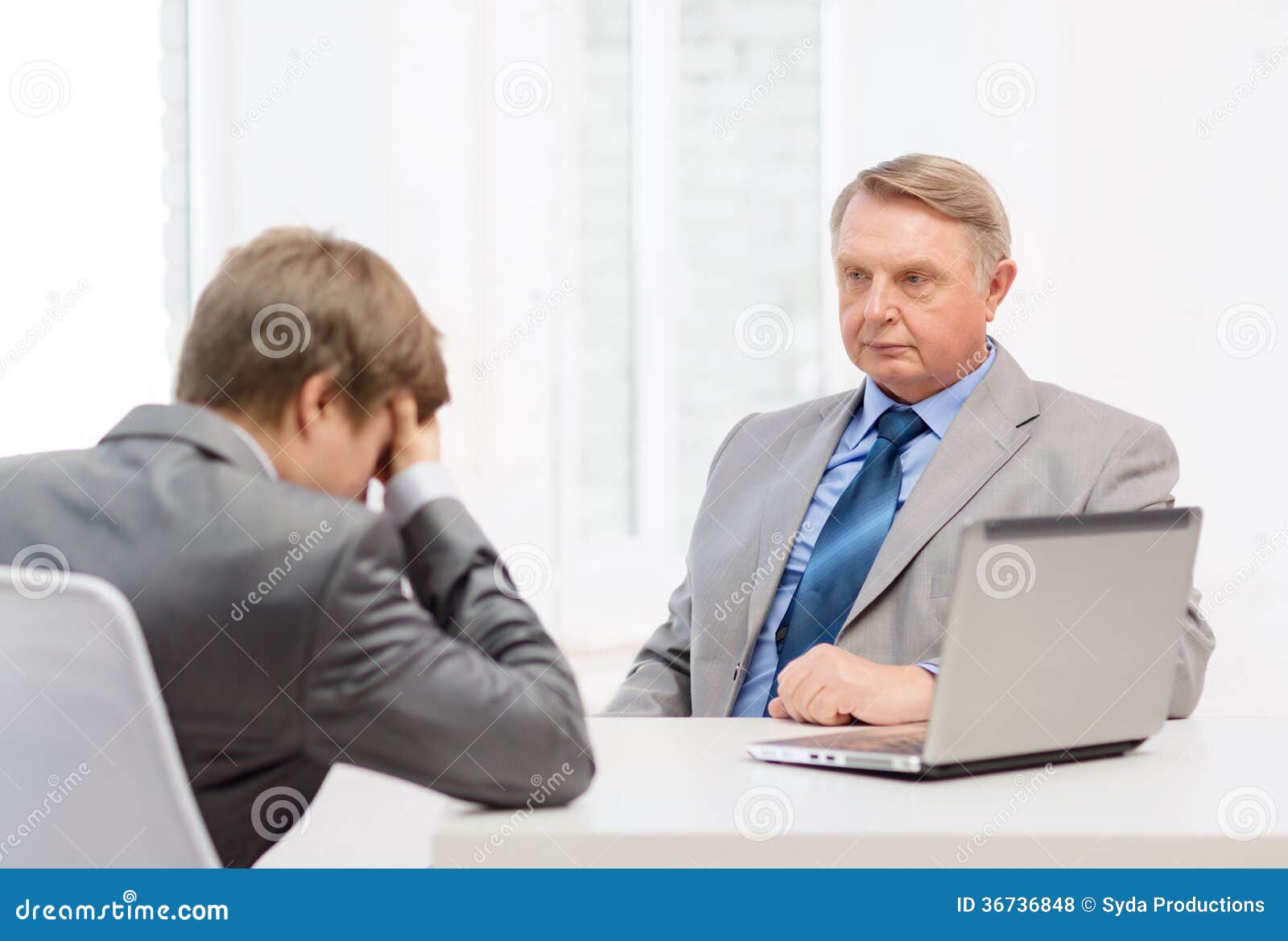Older Man and Young Man Having Argument in Office Stock Photo - Image ...