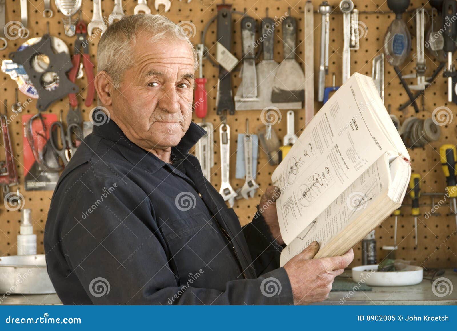 Older Mechanic Reading stock image. Image of wrench, organized - 8902005