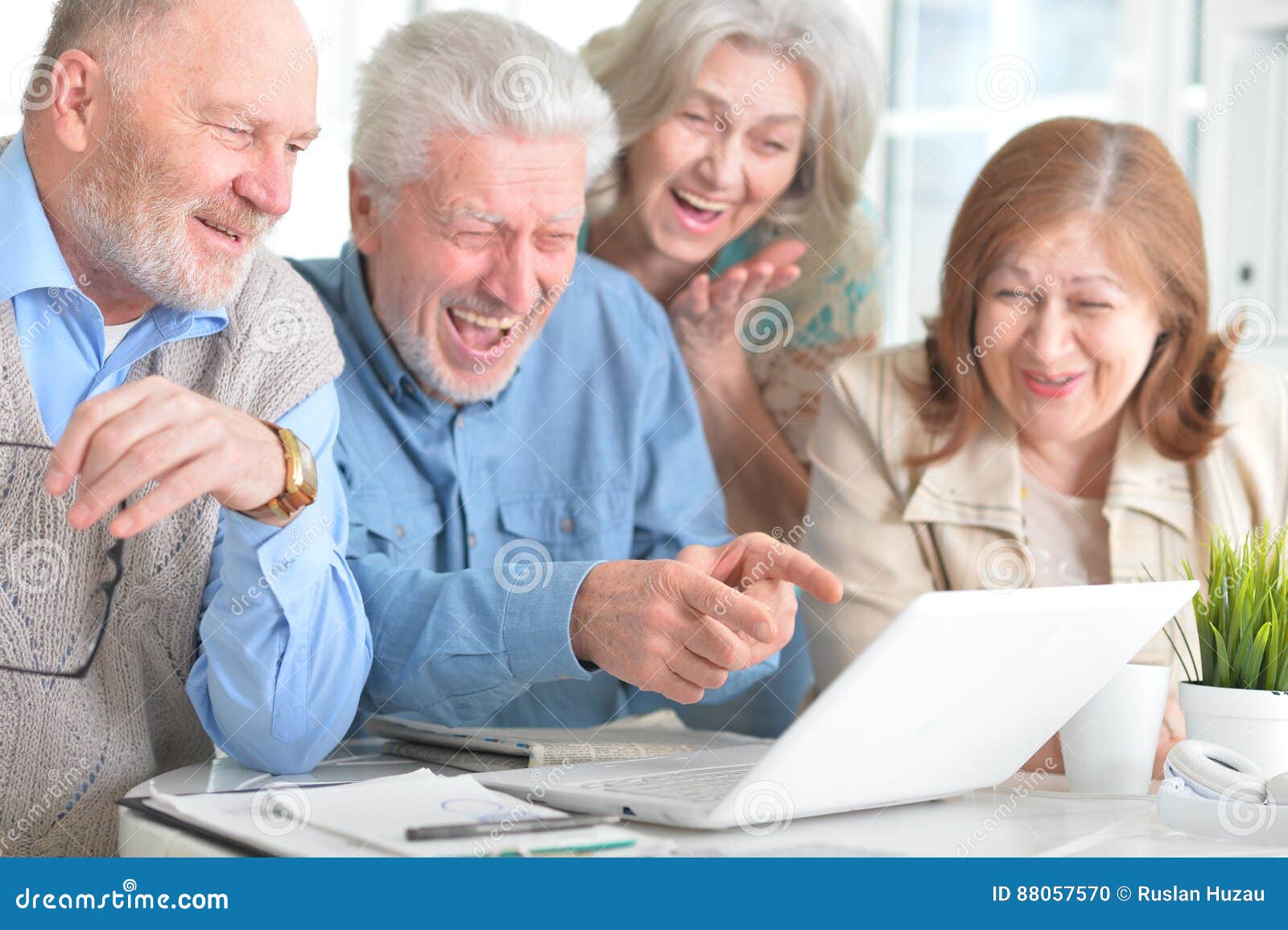 Older people with a laptop stock photo. Image of discussion - 88057570