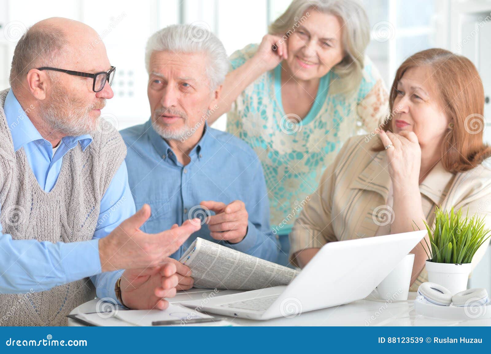Older people with a laptop stock image. Image of meeting - 88123539