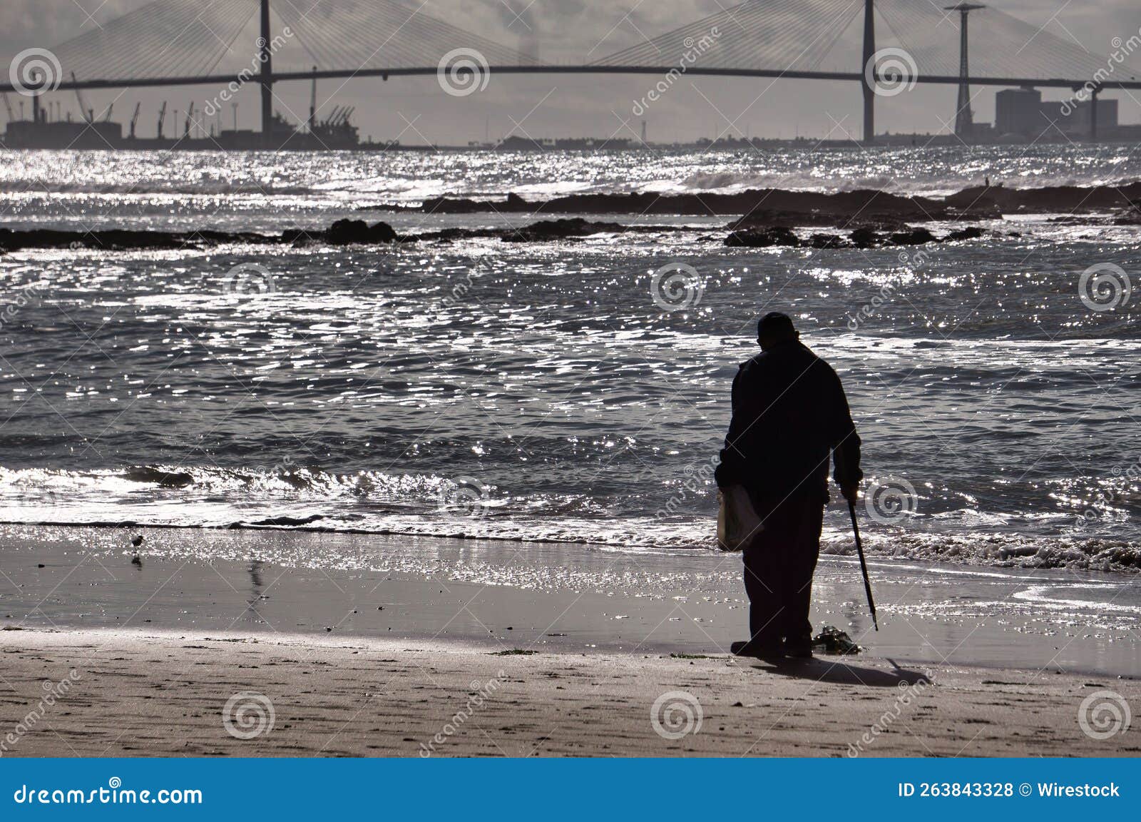 Older Spanish Male Collecting Shells on the Beach Stock Photo - Image ...