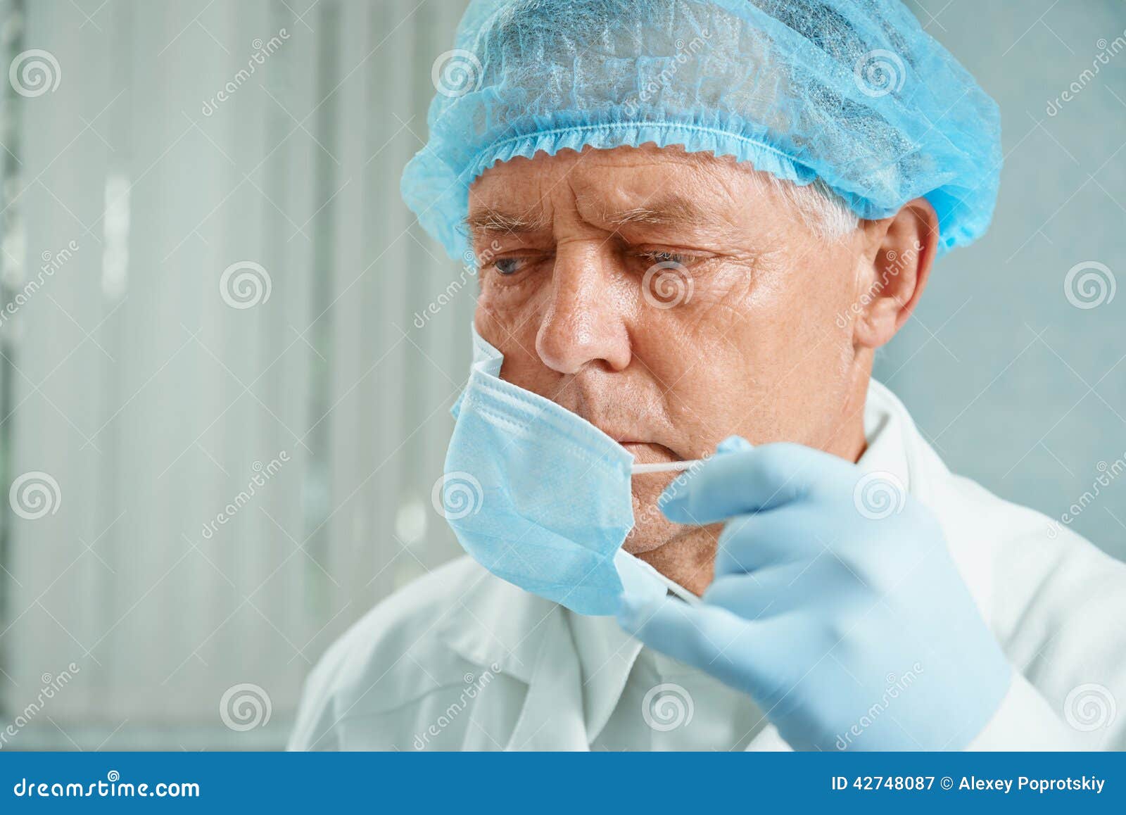 Older Surgeon Takes Off His Protective Mask Stock Image - Image of ...