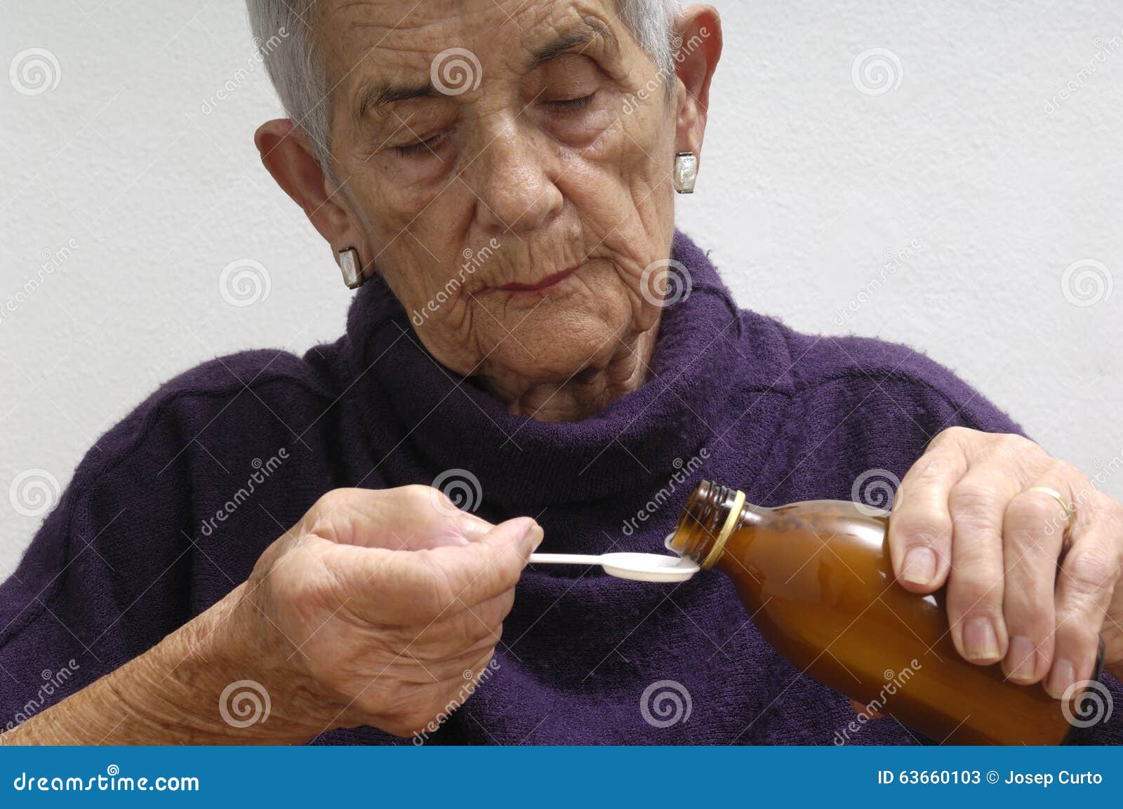 Older woman taking syrup stock image. Image of medicament - 63660103