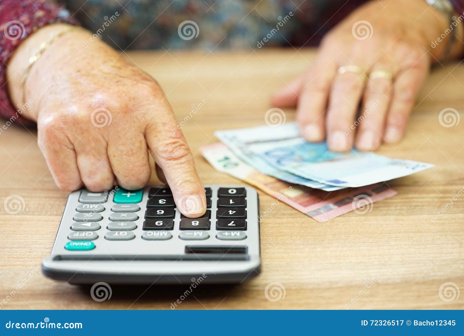 Older Woman is Using Calculator To Calculate All Expenses Stock Image ...