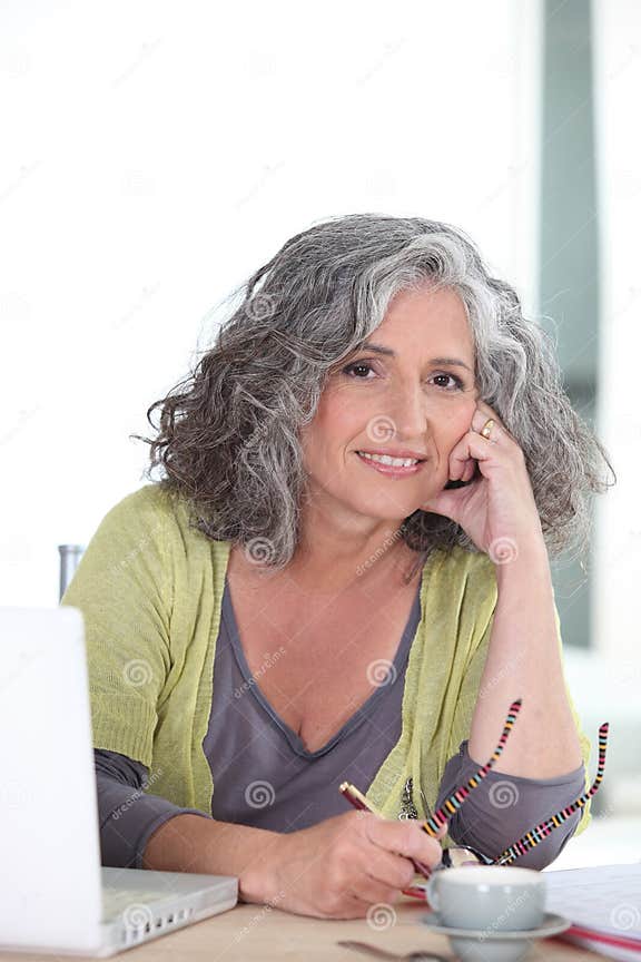 Older woman using a laptop stock image. Image of leisure - 52683181