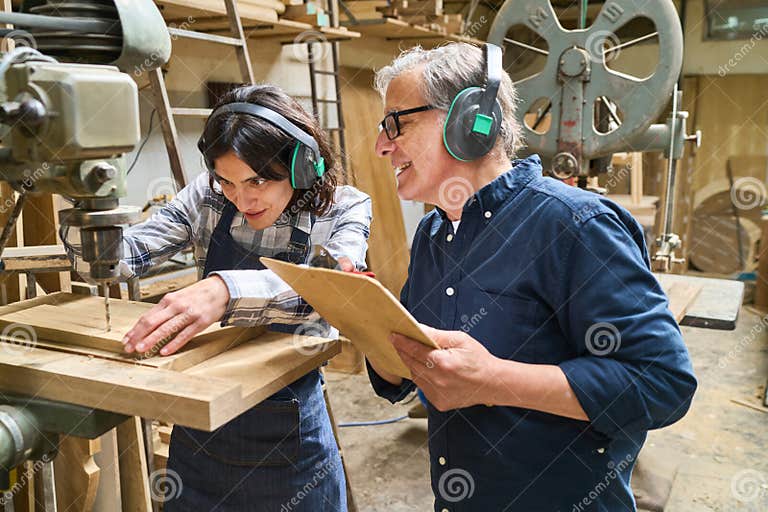 Older and Younger Workers Collaborating in a Busy Lumberyard Workshop Stock Image - Image of ...