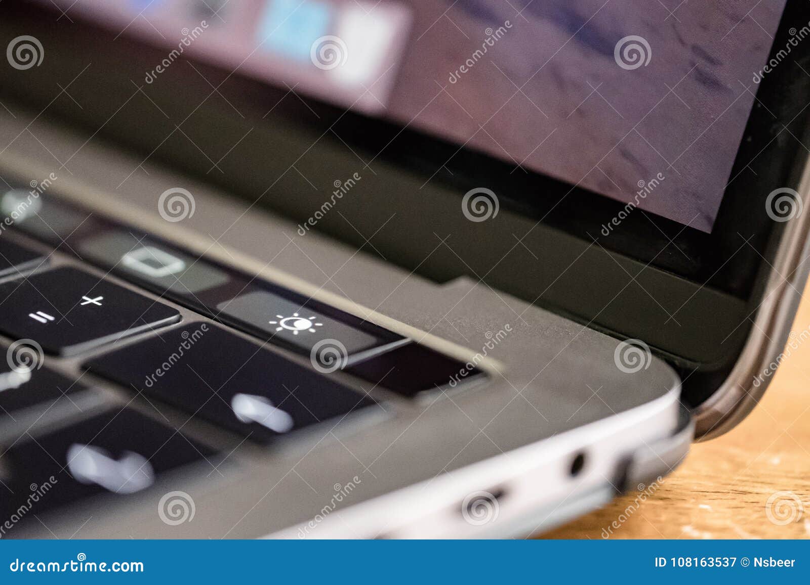 Shallow Focus of a OLED Brightness Button Seen on a Well-known, Luxury ...