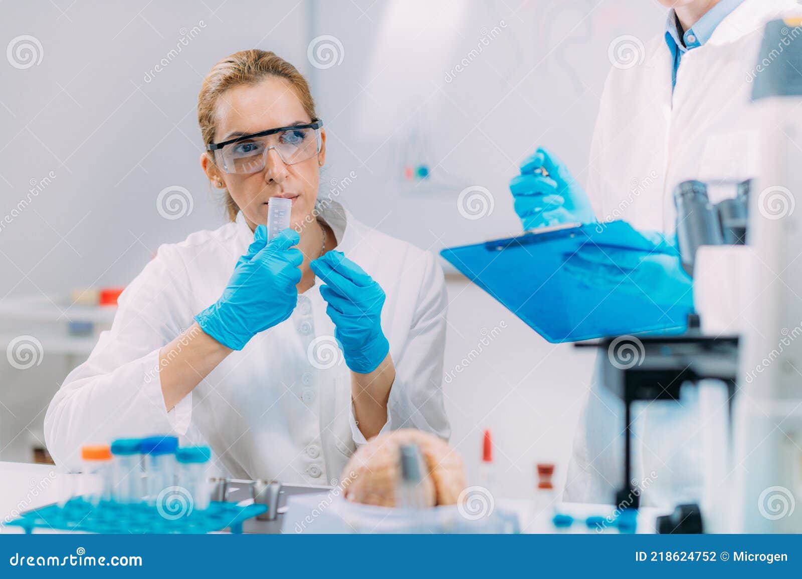 Olfactory Test in the Lab. Female Scientists Smelling a Sample in the ...